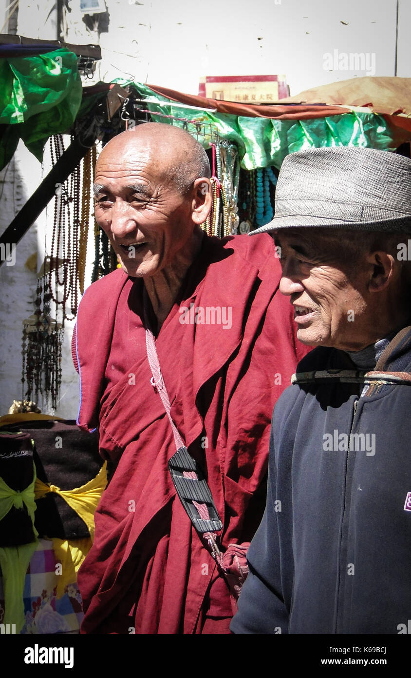 Tibet, China - Sep 7, 2012. Tibetan people walk around Jokhang temple ...