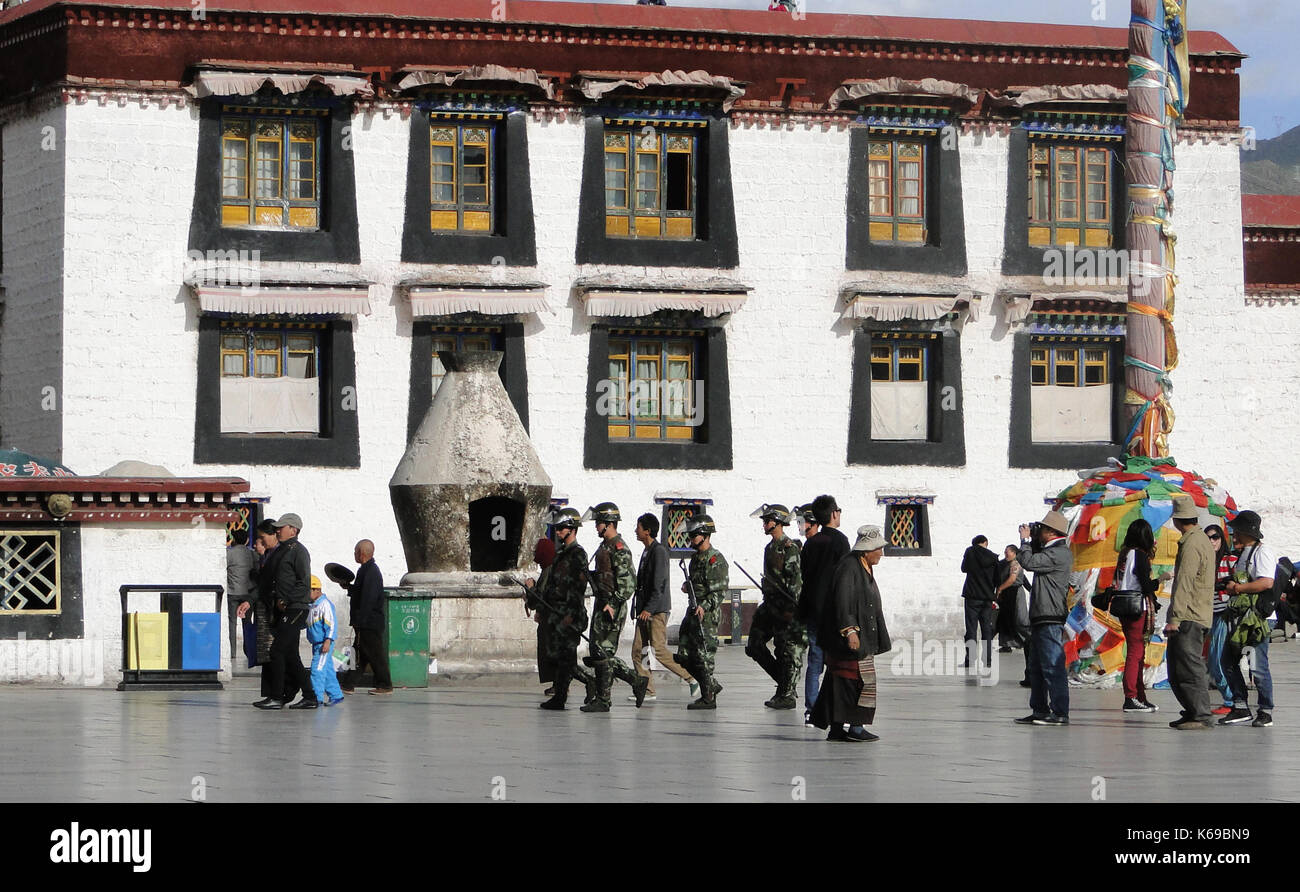 Tibet, China - Sep 7, 2012. Chinese soldiers walking at the Jokhang ...