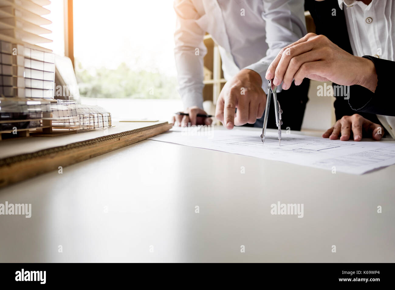 Person's engineer Hand Drawing Plan On Blue Print with architect ...
