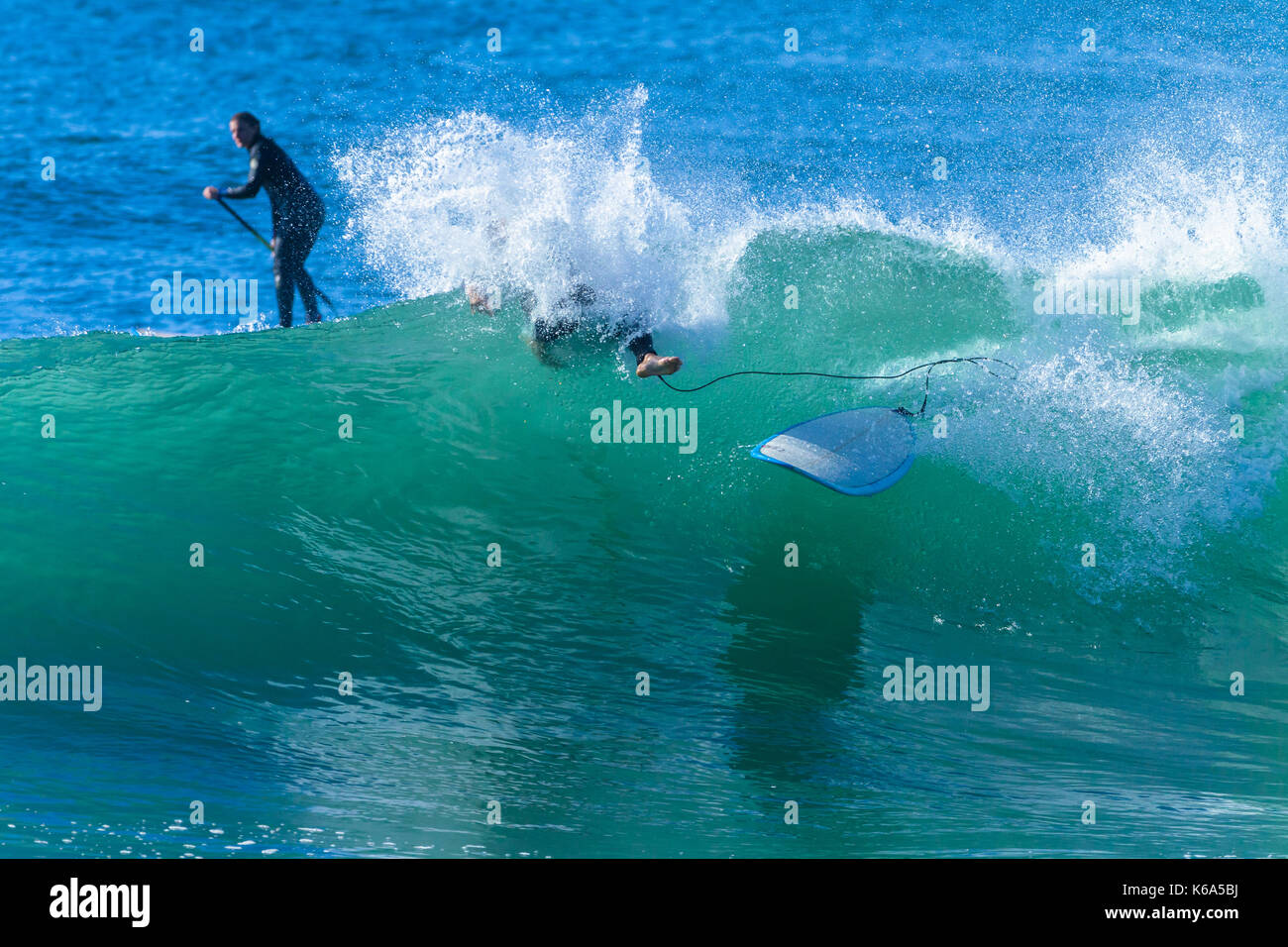 Surfer Girl surfing ocean wave action photo Stock Photo - Alamy