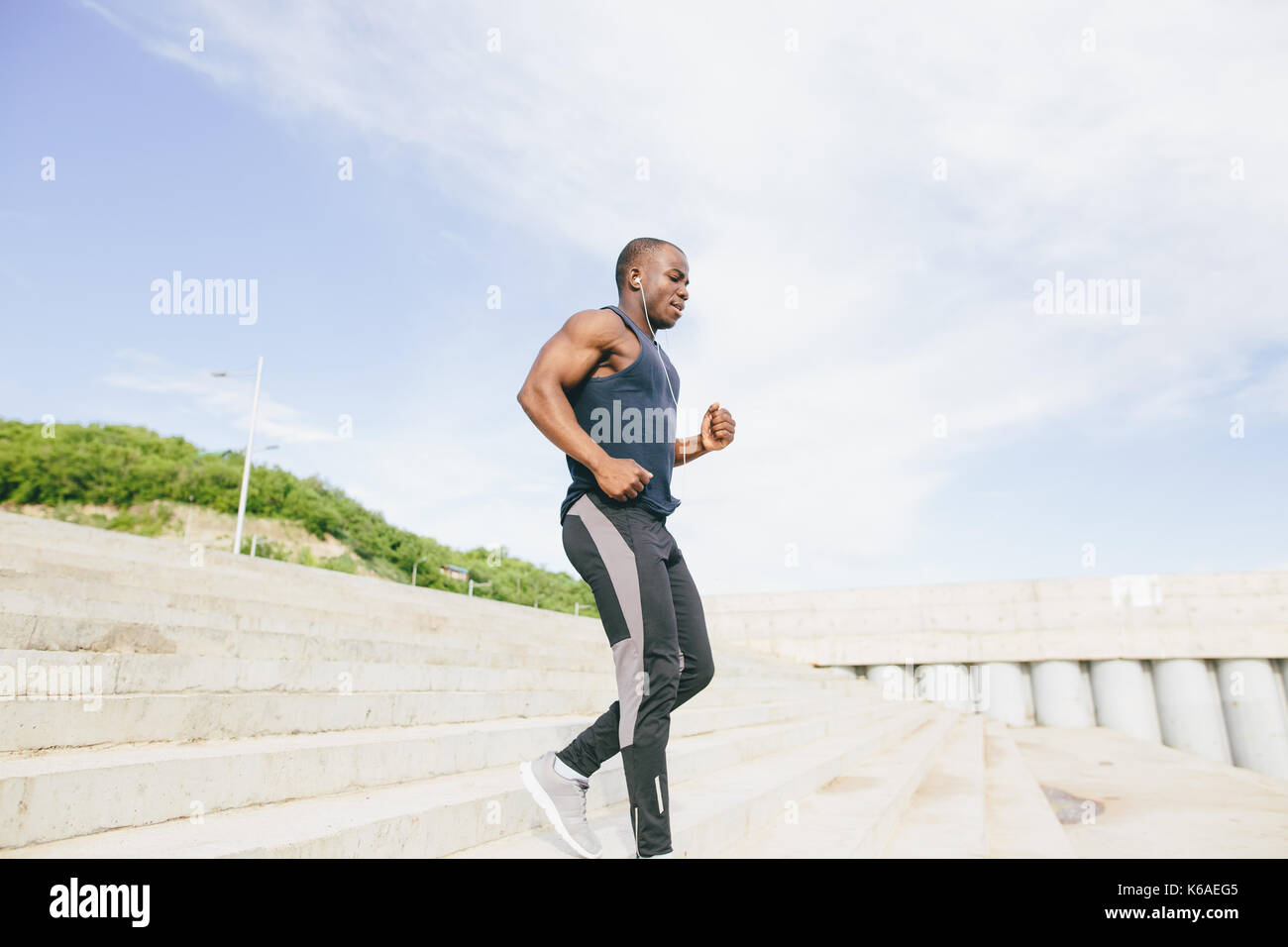 Black man running up stairs hi-res stock photography and images - Alamy