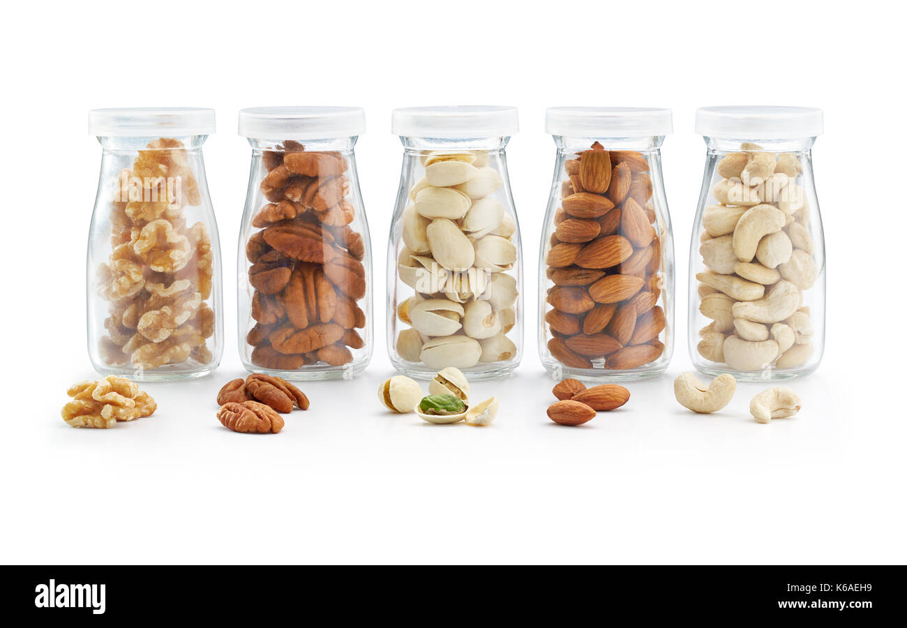 Healthy nuts in the bottle isolated on white Stock Photo - Alamy