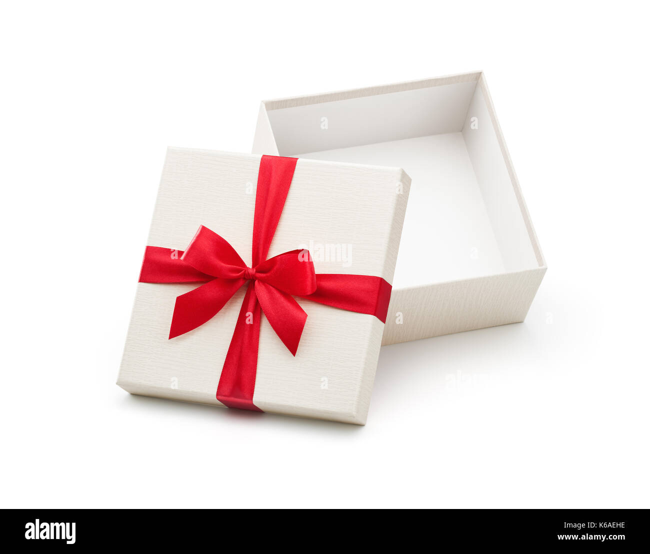 White open gift box with red bow isolated on white background ...