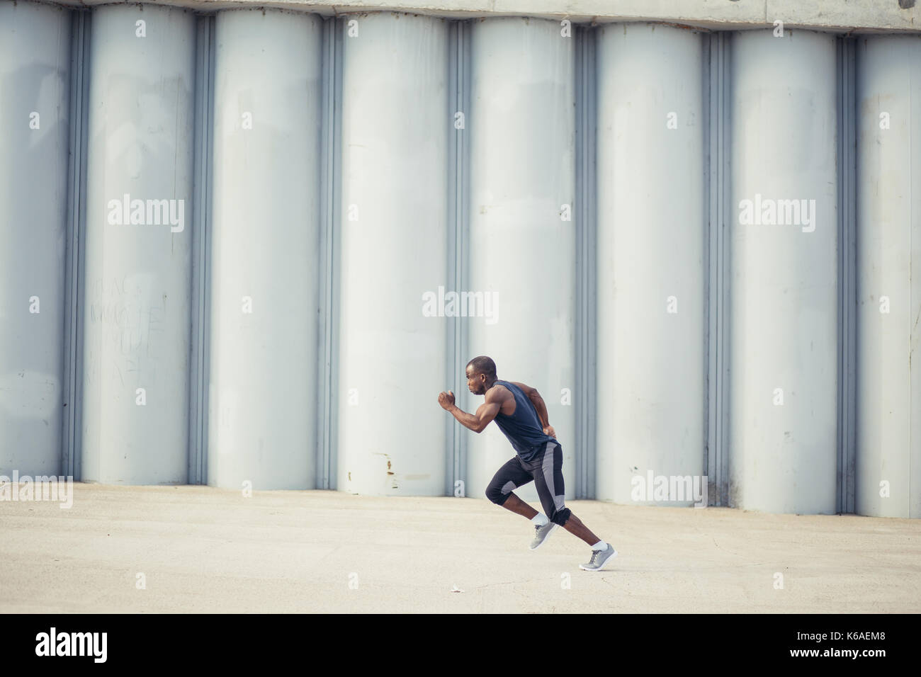 Man start running on the pathway with the blue sky in the background ...
