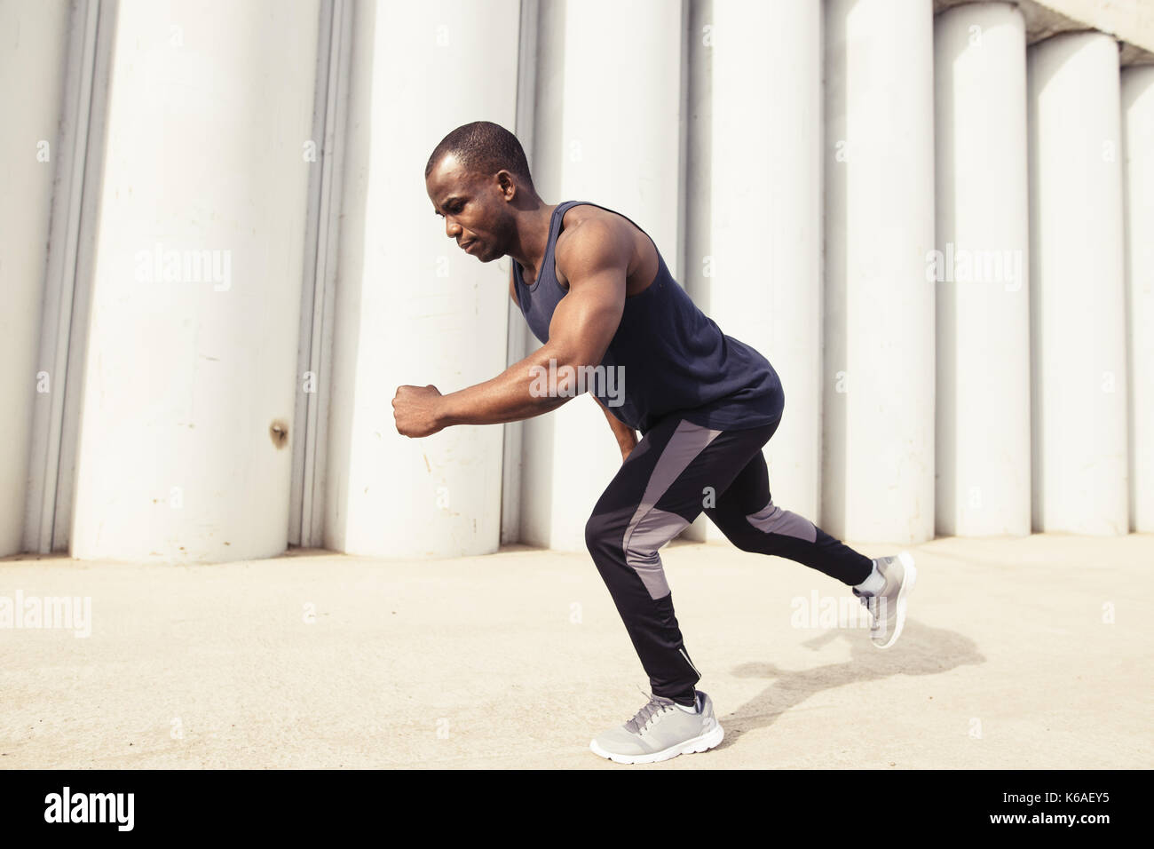 one young african muscular build man on starting pose Stock Photo - Alamy