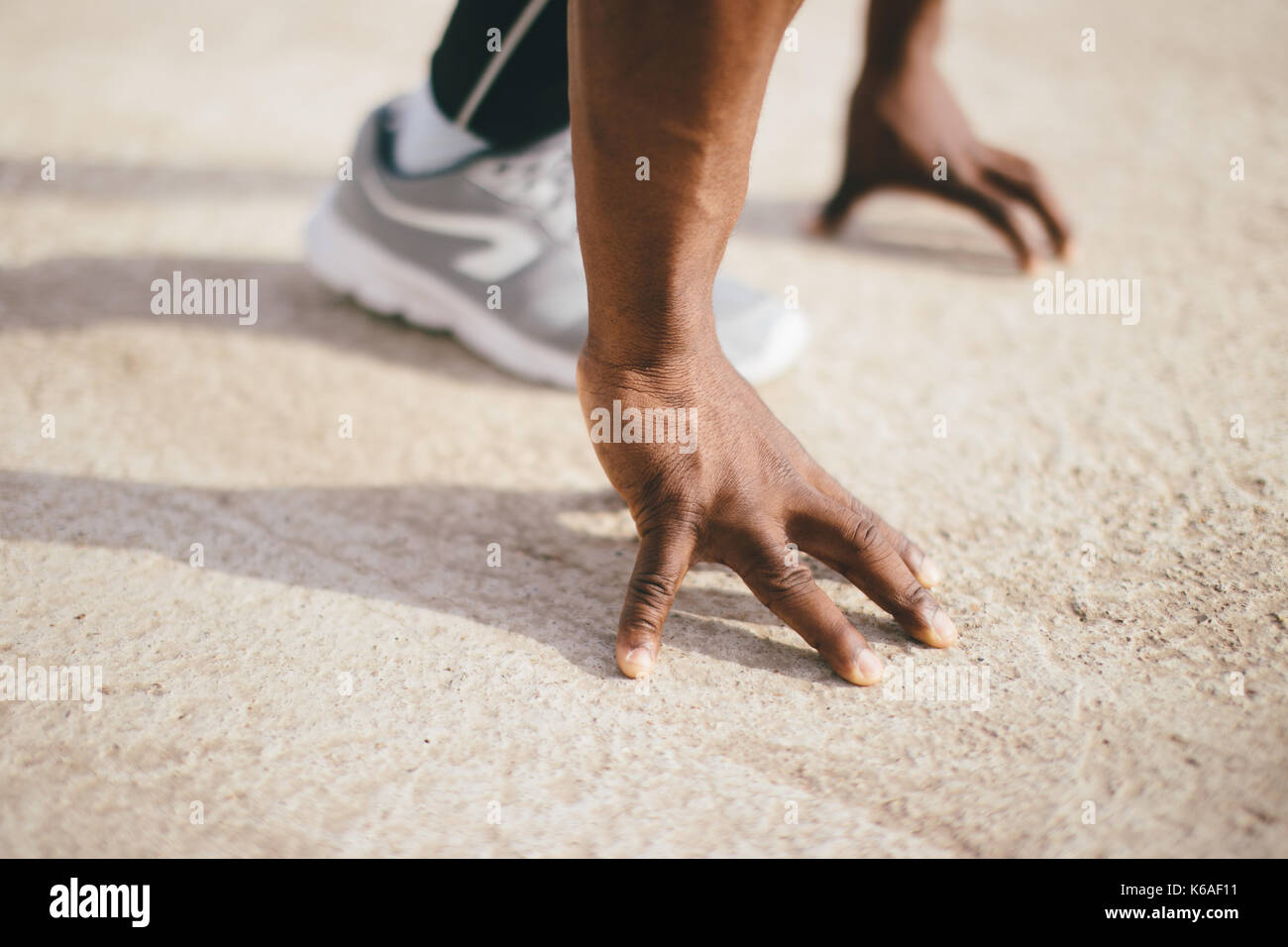 one young african muscular build man on starting pose Stock Photo - Alamy