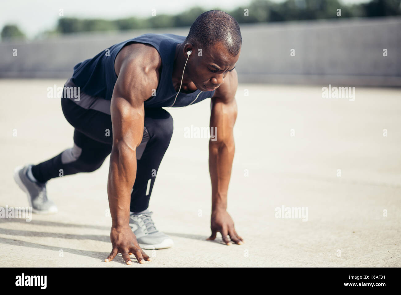 one young african muscular build man on starting pose Stock Photo - Alamy