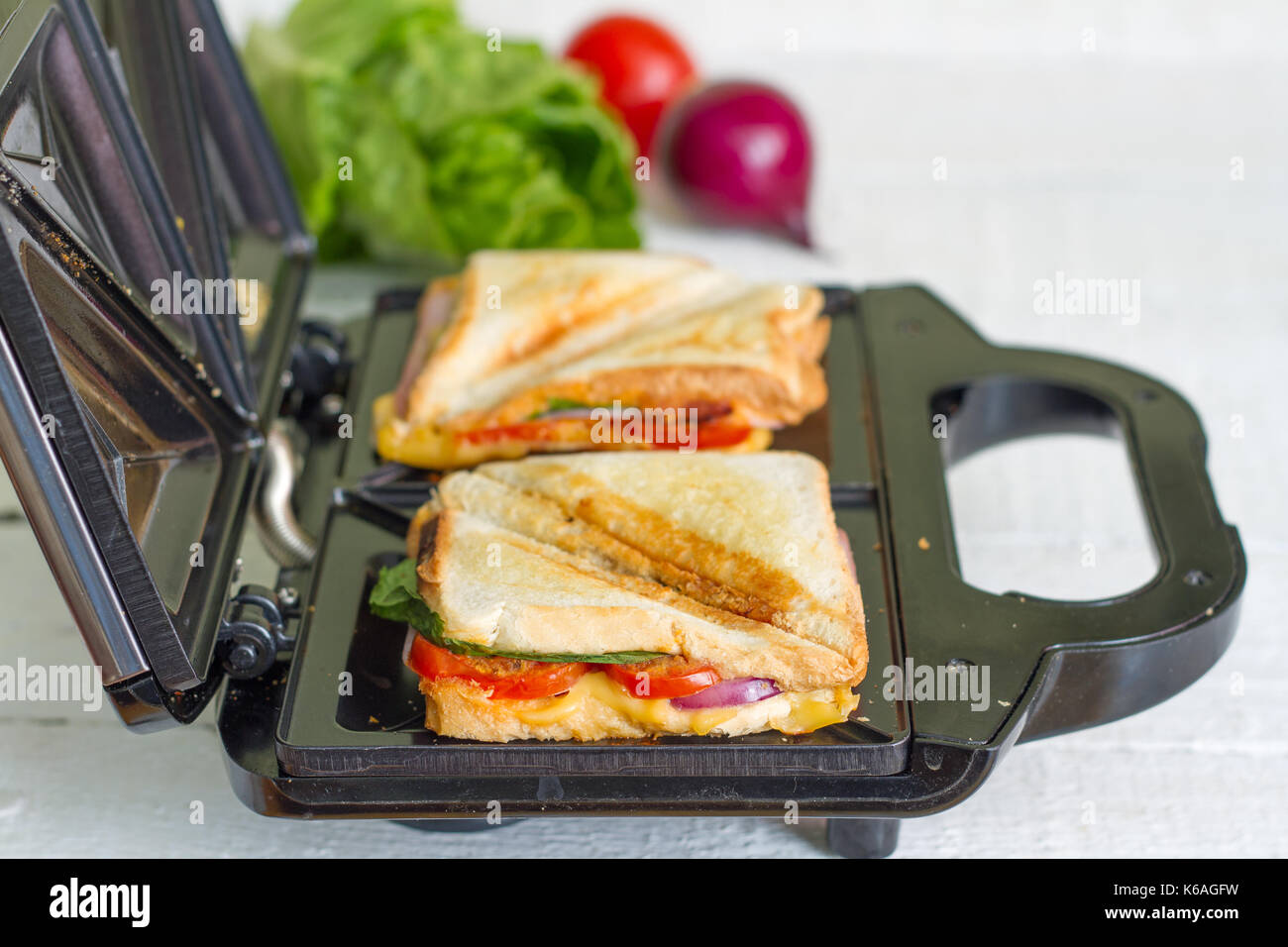 Sandwich toaster with toast and ingredients Stock Photo - Alamy