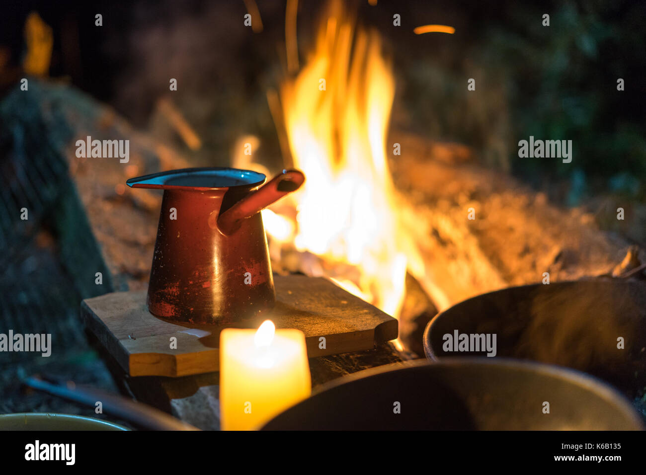 Evening tea prepared at a campfire Stock Photo - Alamy