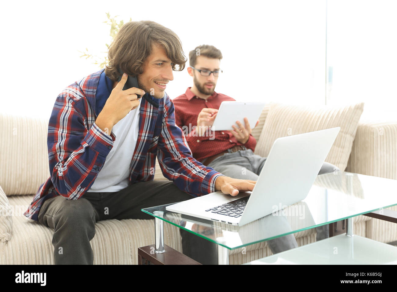Two person speaking smart phone hi-res stock photography and images - Alamy