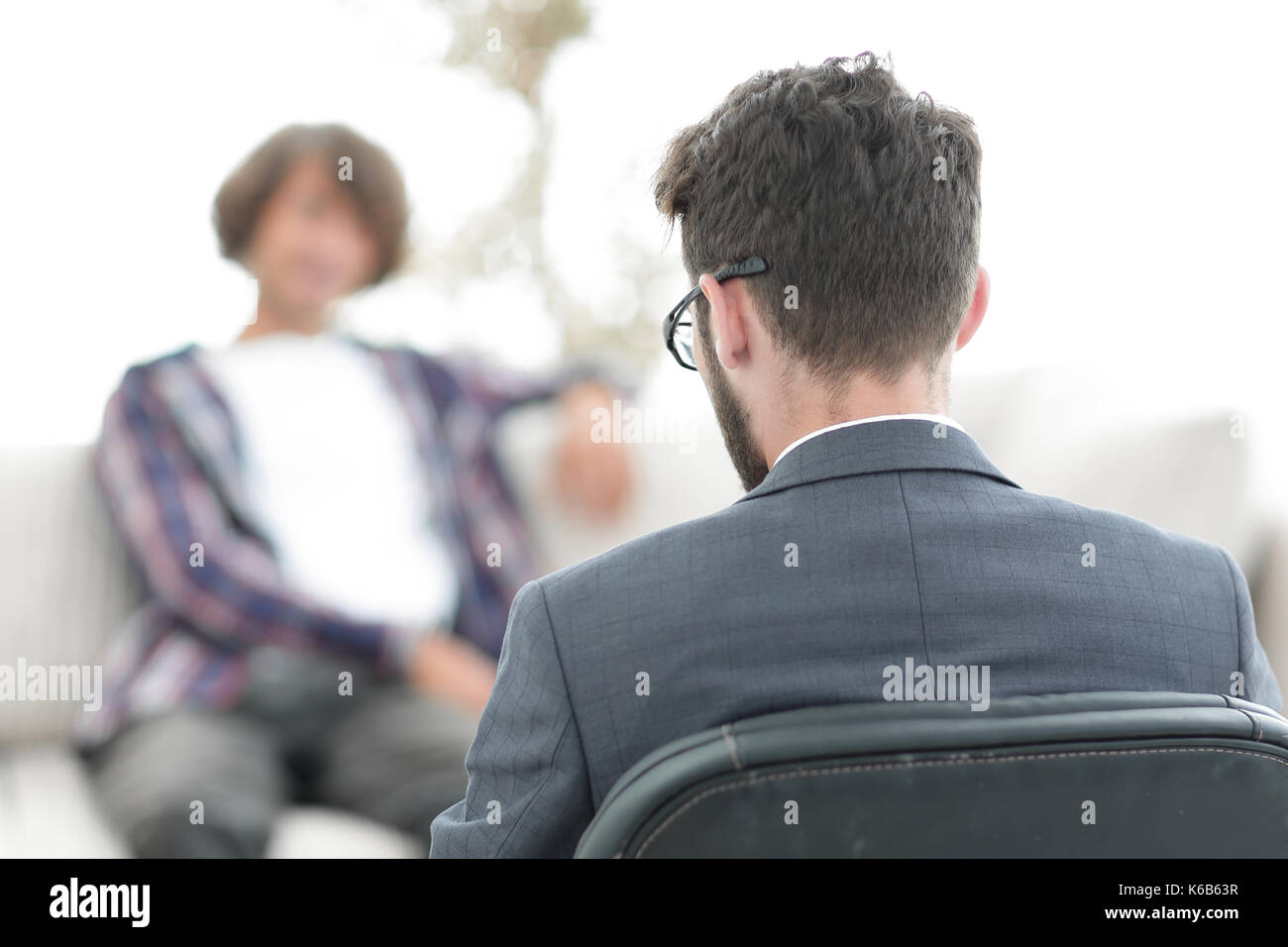 lawyer advises his client. back view. concept of confidentiality Stock ...