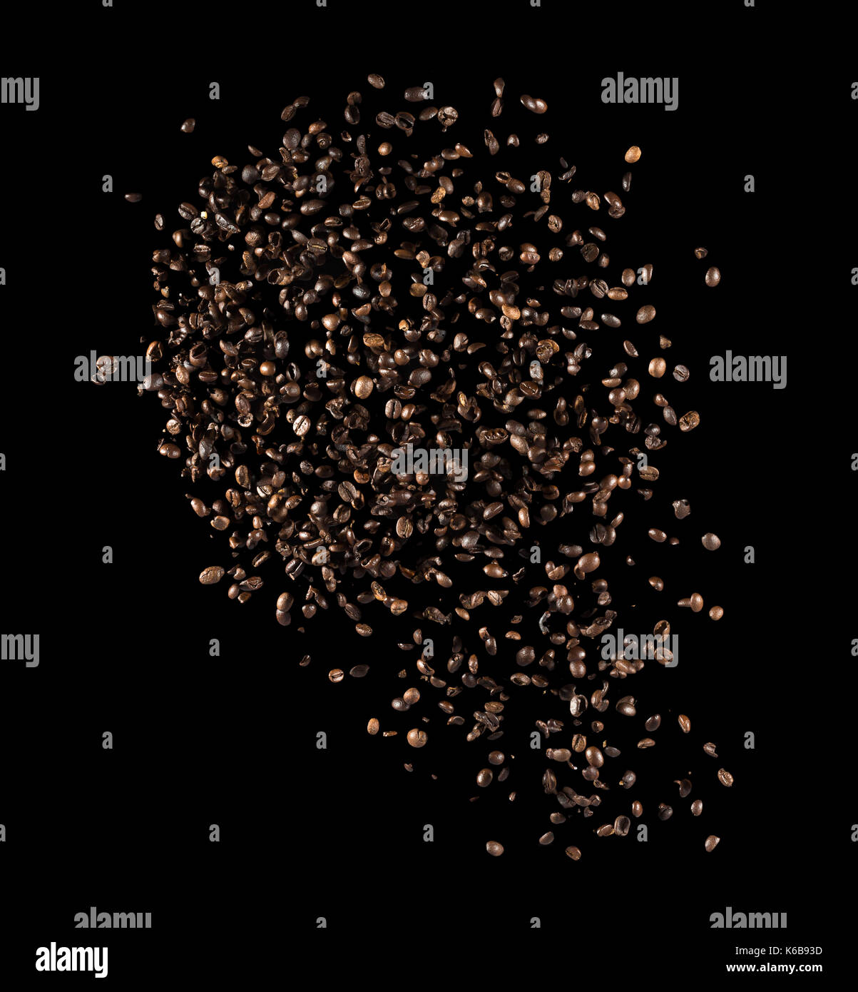 falling coffee beans on black background Stock Photo - Alamy
