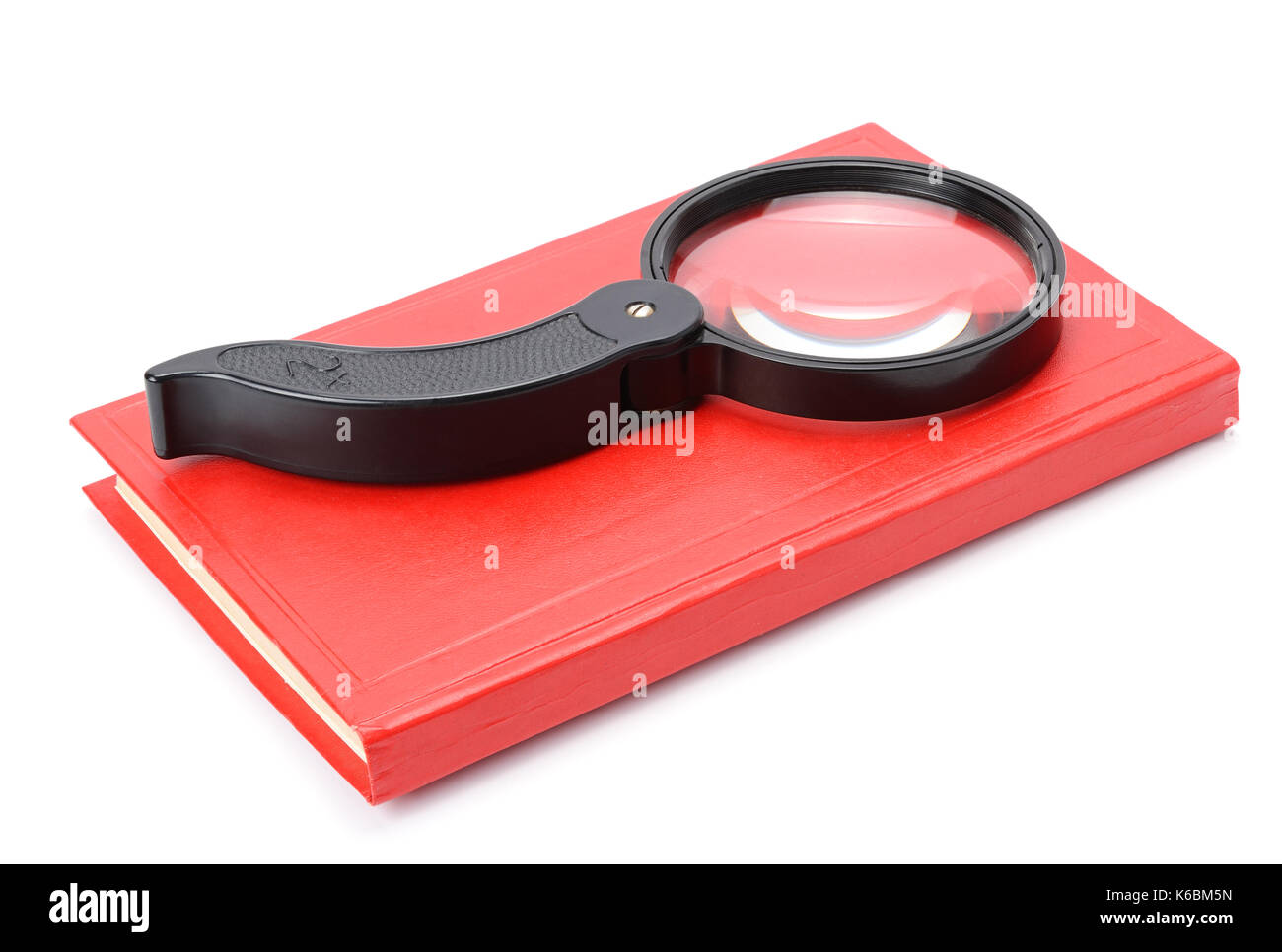 book and magnifying glass isolated on white background Stock Photo - Alamy