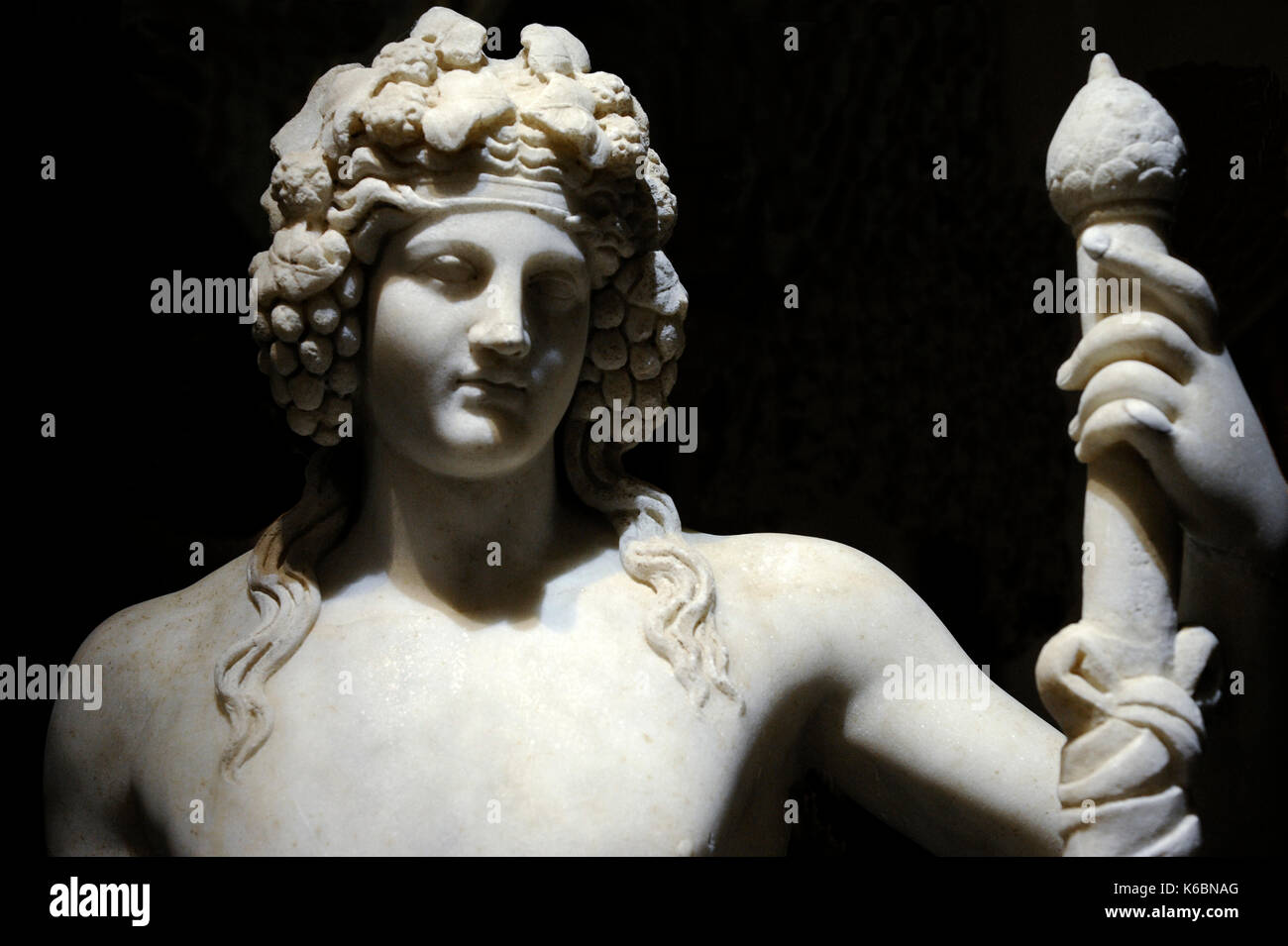 Statue of Dionysus, God of Wine, with crown of grape clusters. Detail ...