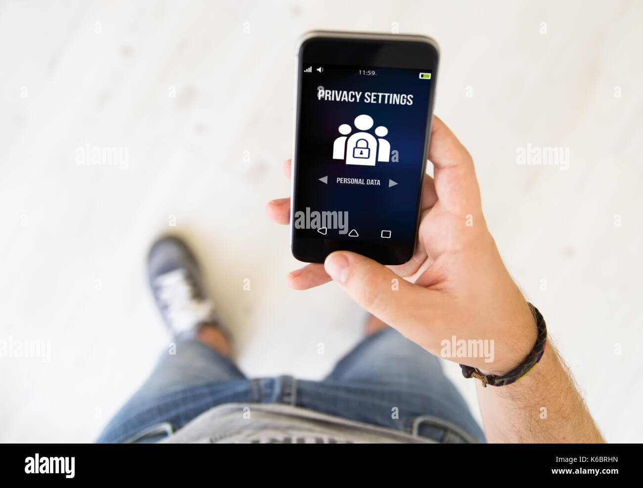 close up of male hand using privacy settings smart phone Stock Photo ...