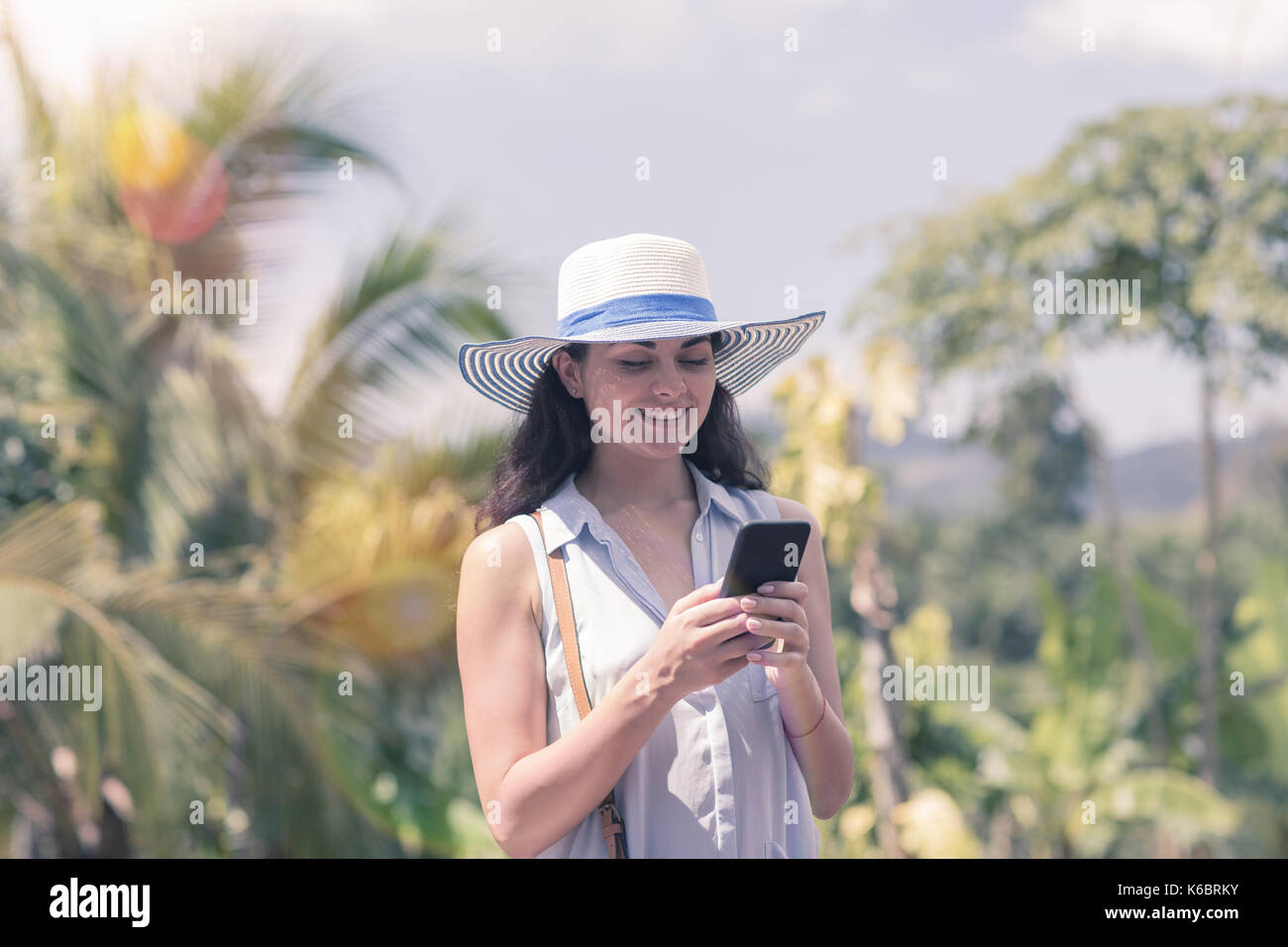 Attractive Woman In Hat Communicating With Cell Smart Phone Over ...