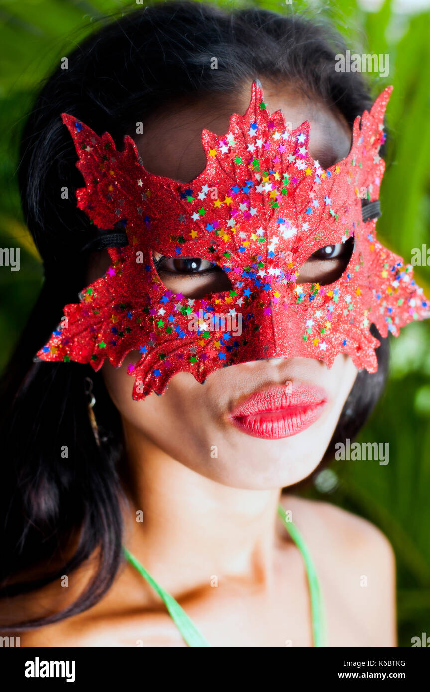 Young Asian woman wearing mask in interior setting, Cebu, Philippines ...