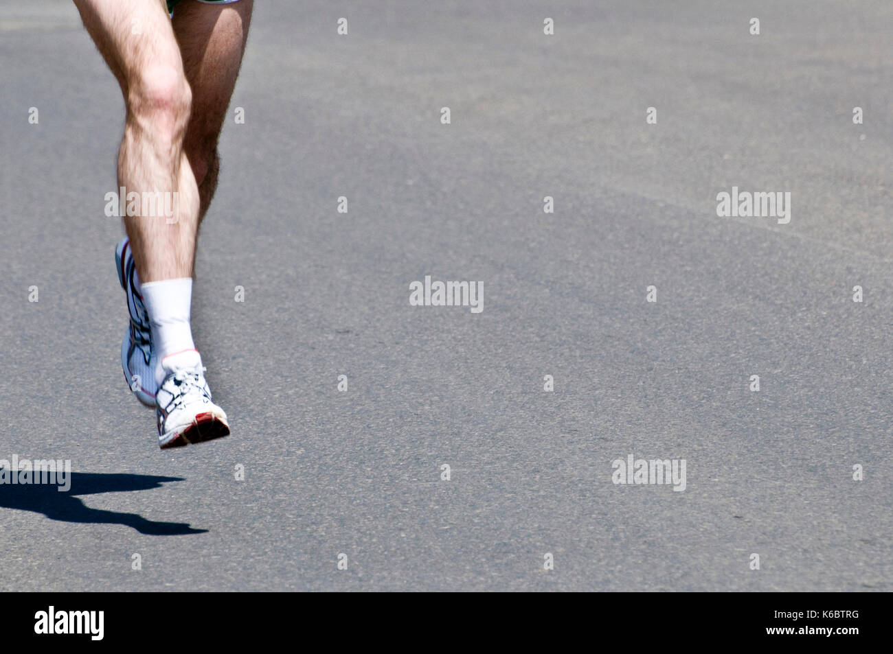 legs of a marathon runner Stock Photo - Alamy