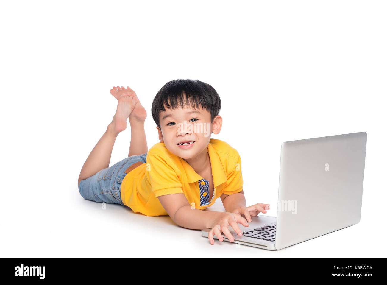 Kid on laptop Cut Out Stock Images & Pictures - Alamy