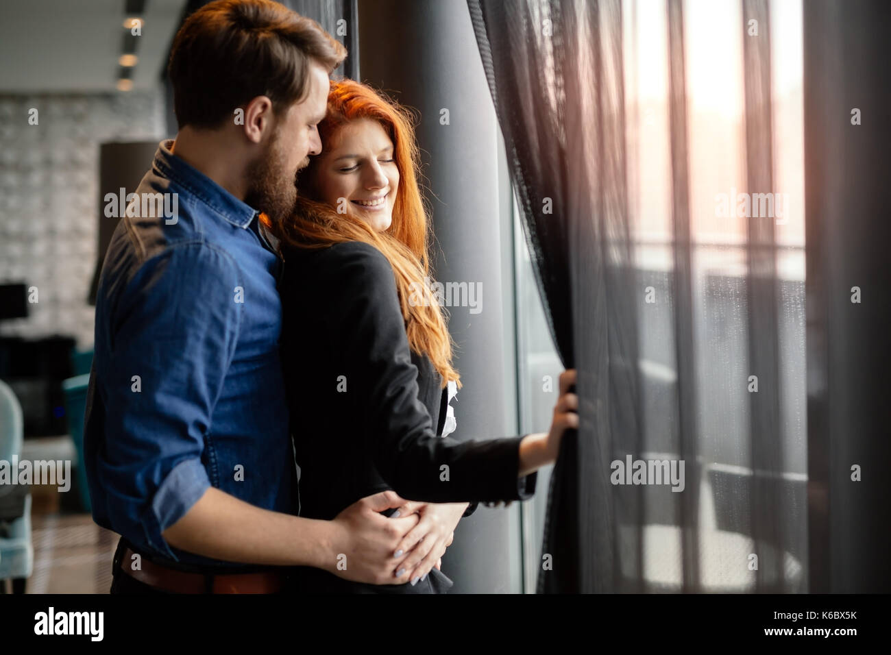 Beautiful romantic couple hugging Stock Photo - Alamy