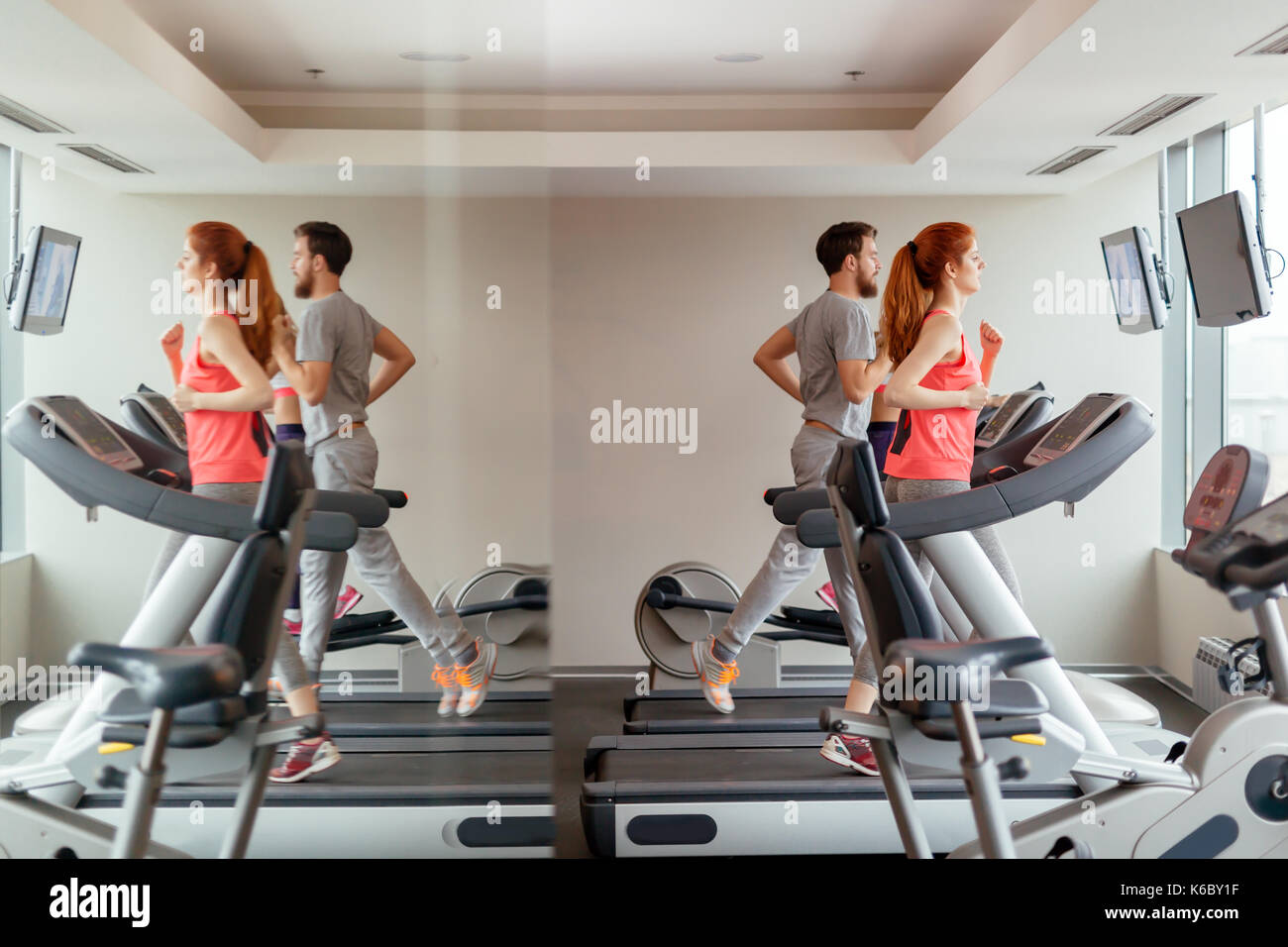 People running on treadmills in gym Stock Photo - Alamy