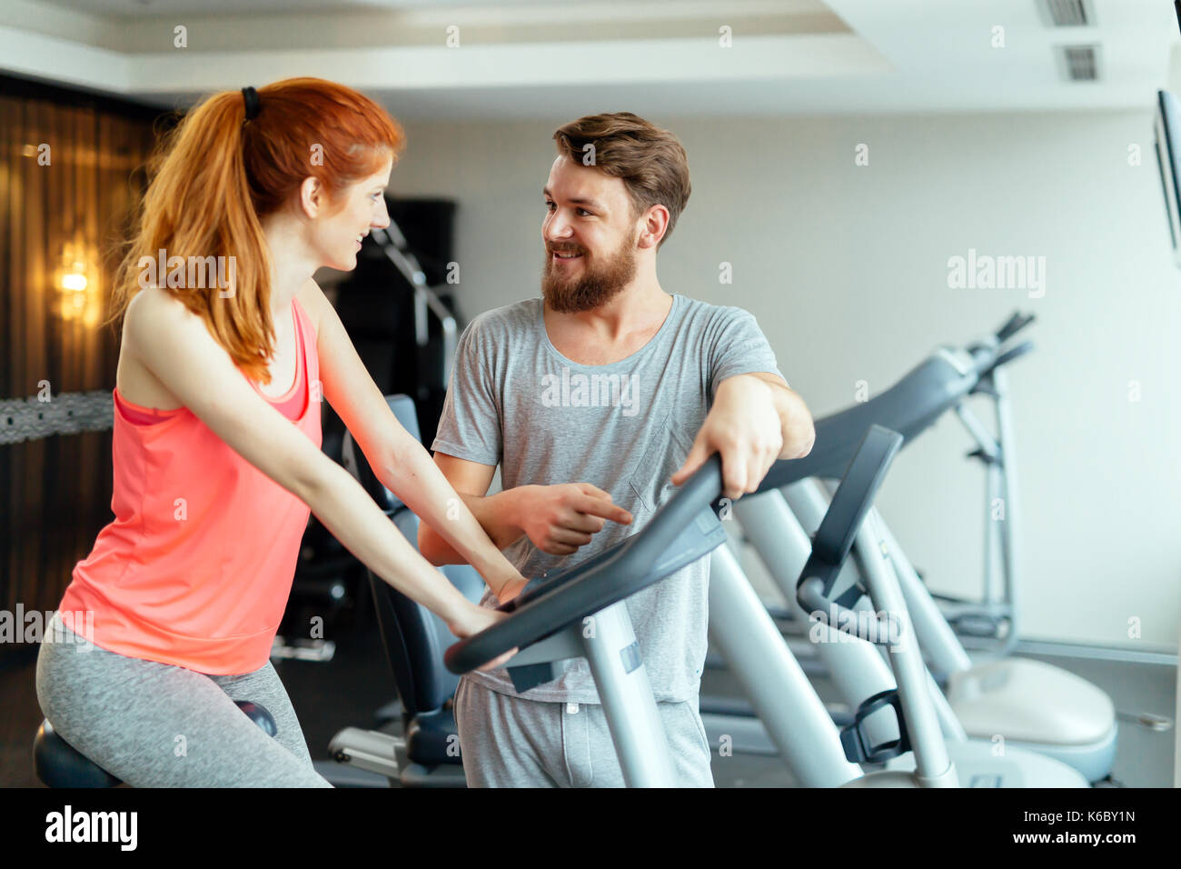 Personal trainer giving instructions Stock Photo - Alamy
