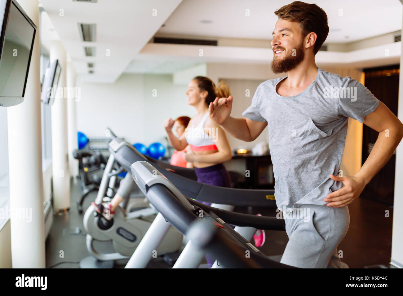 People running on treadmill in gym Stock Photo - Alamy