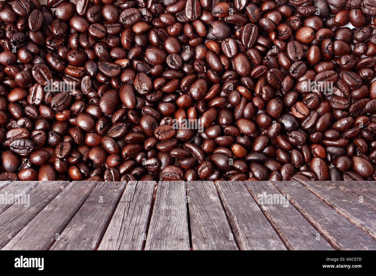 wood table coffee beans background Stock Photo - Alamy