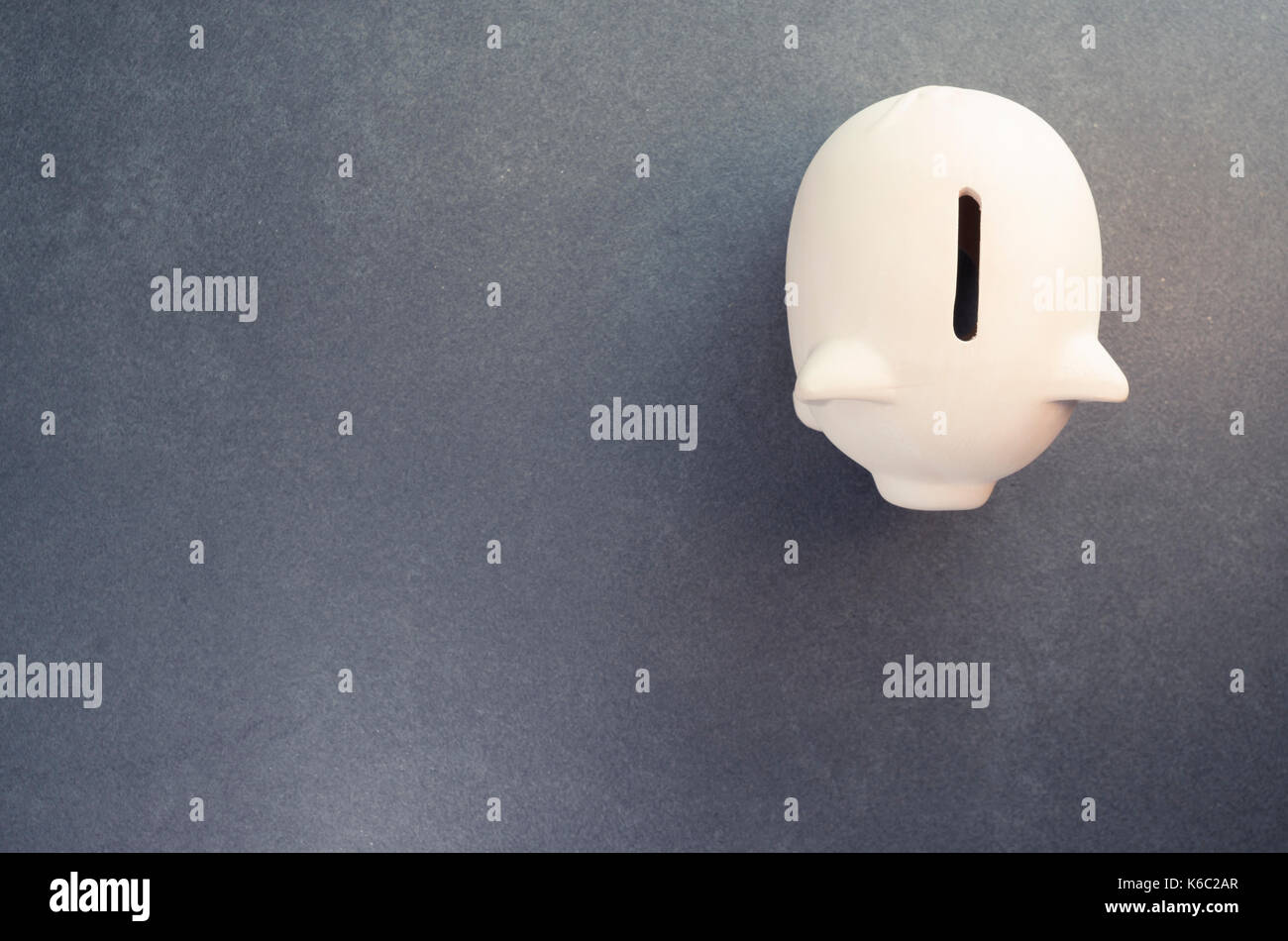 terracotta piggy bank on a stone background - money saving concept ...