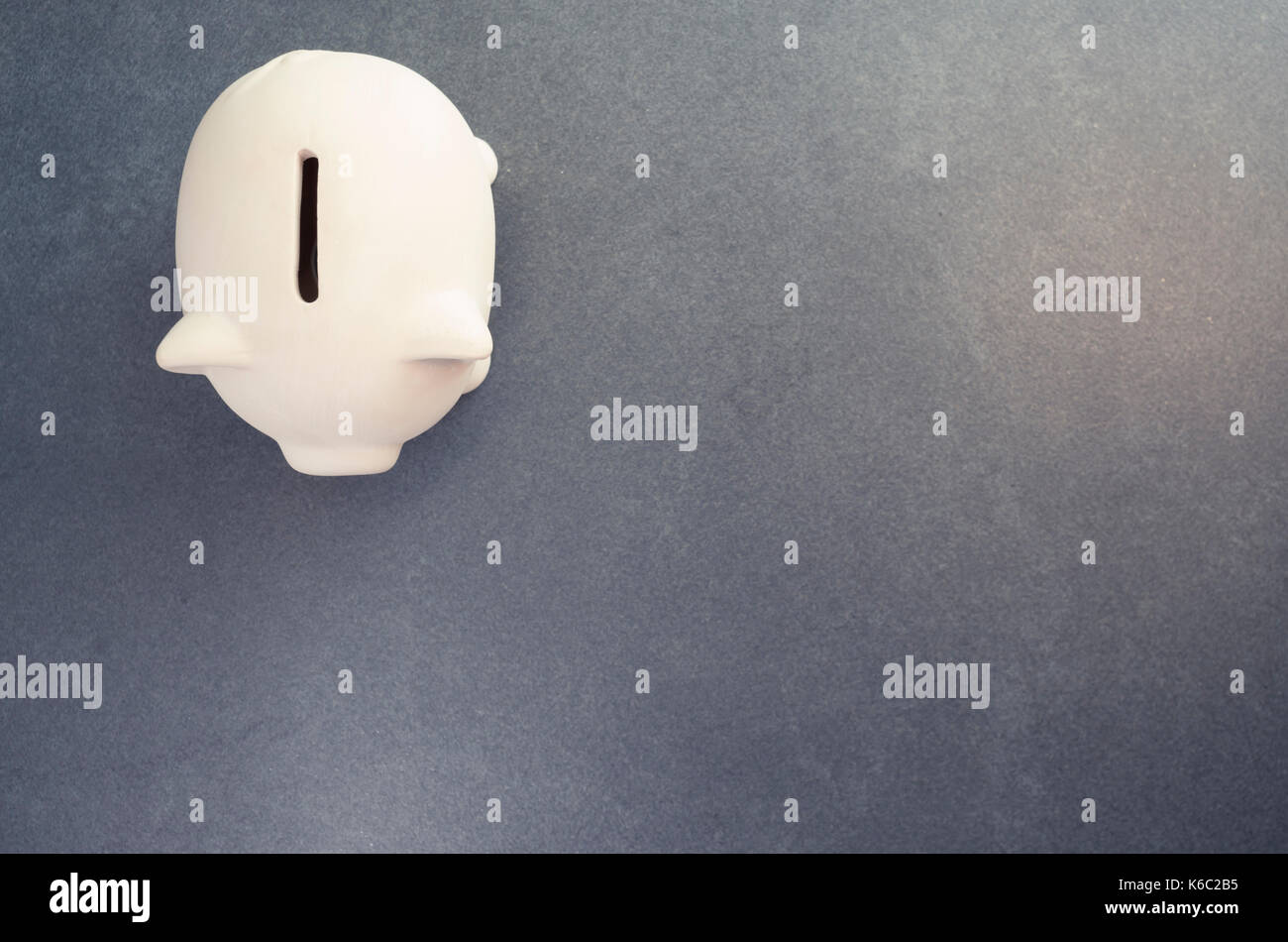 terracotta piggy bank on a stone background - money saving concept ...