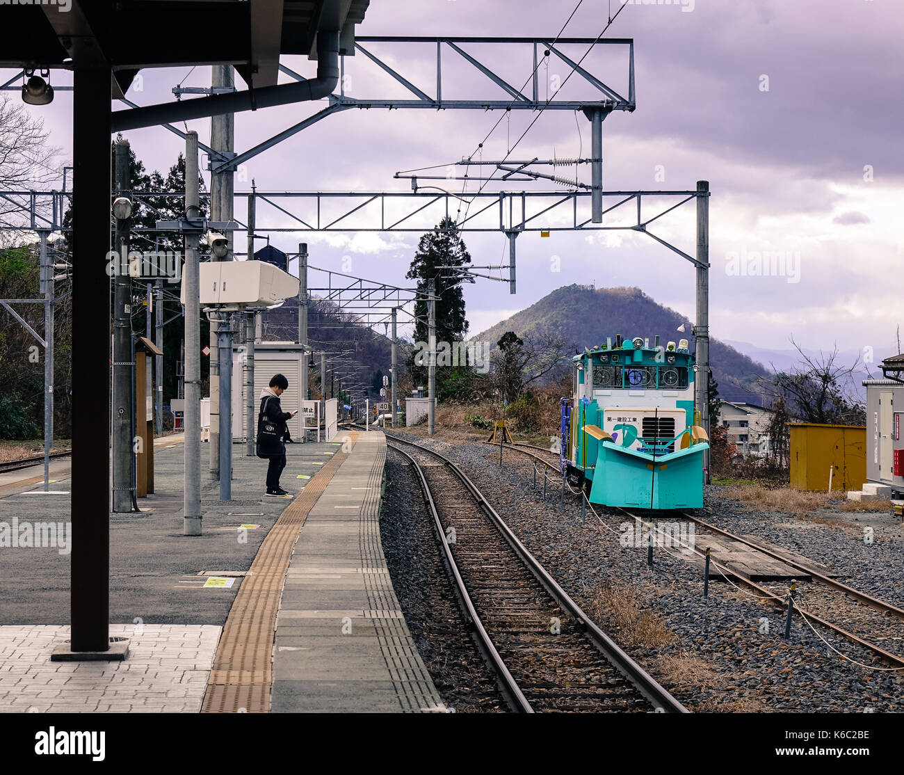 Yamadera, Japan - Dec 5, 2016. A man waiting at railway station in ...