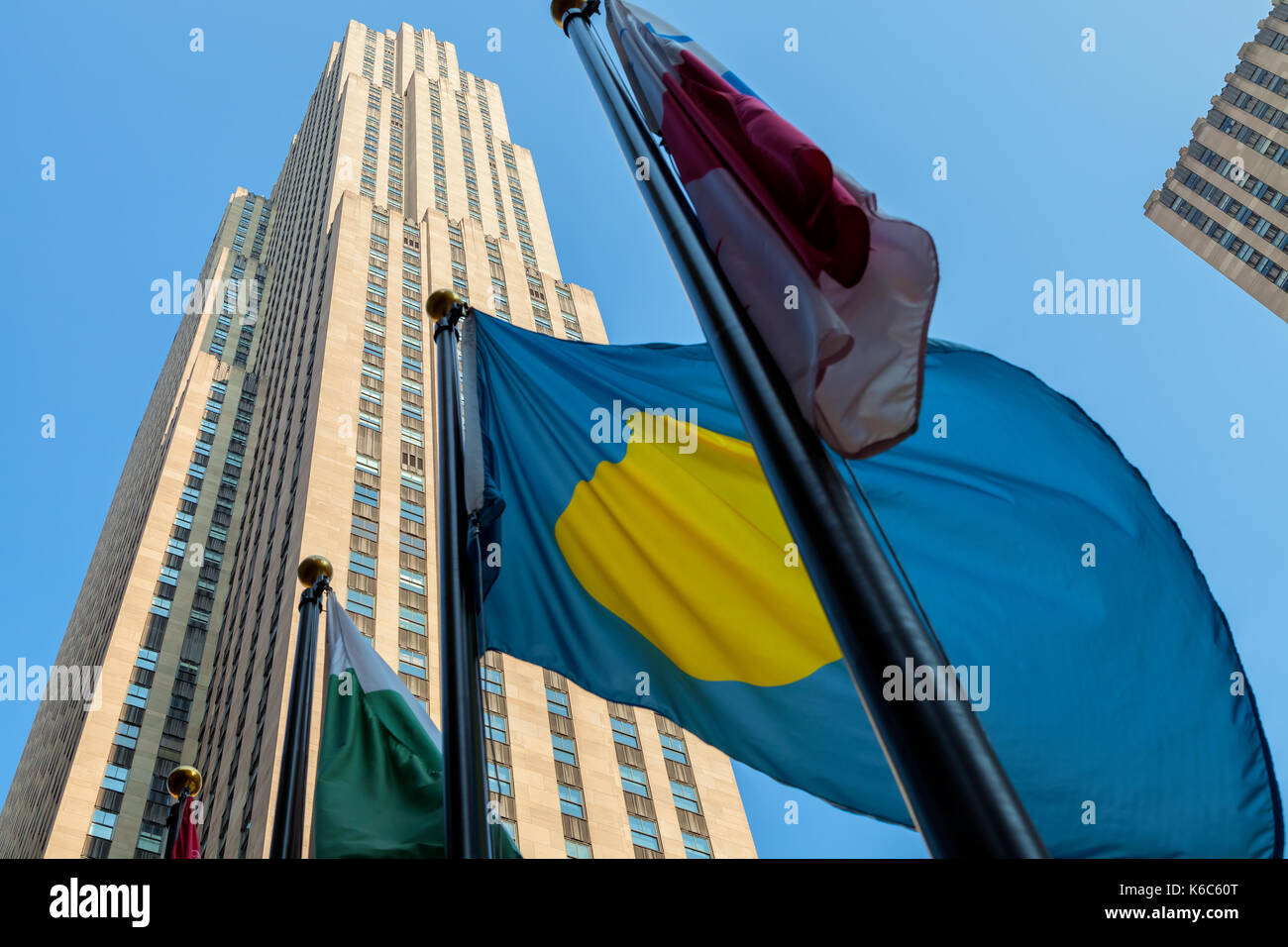 A Palauan flag flies at the Rockefeller Center with the Rockefeller ...