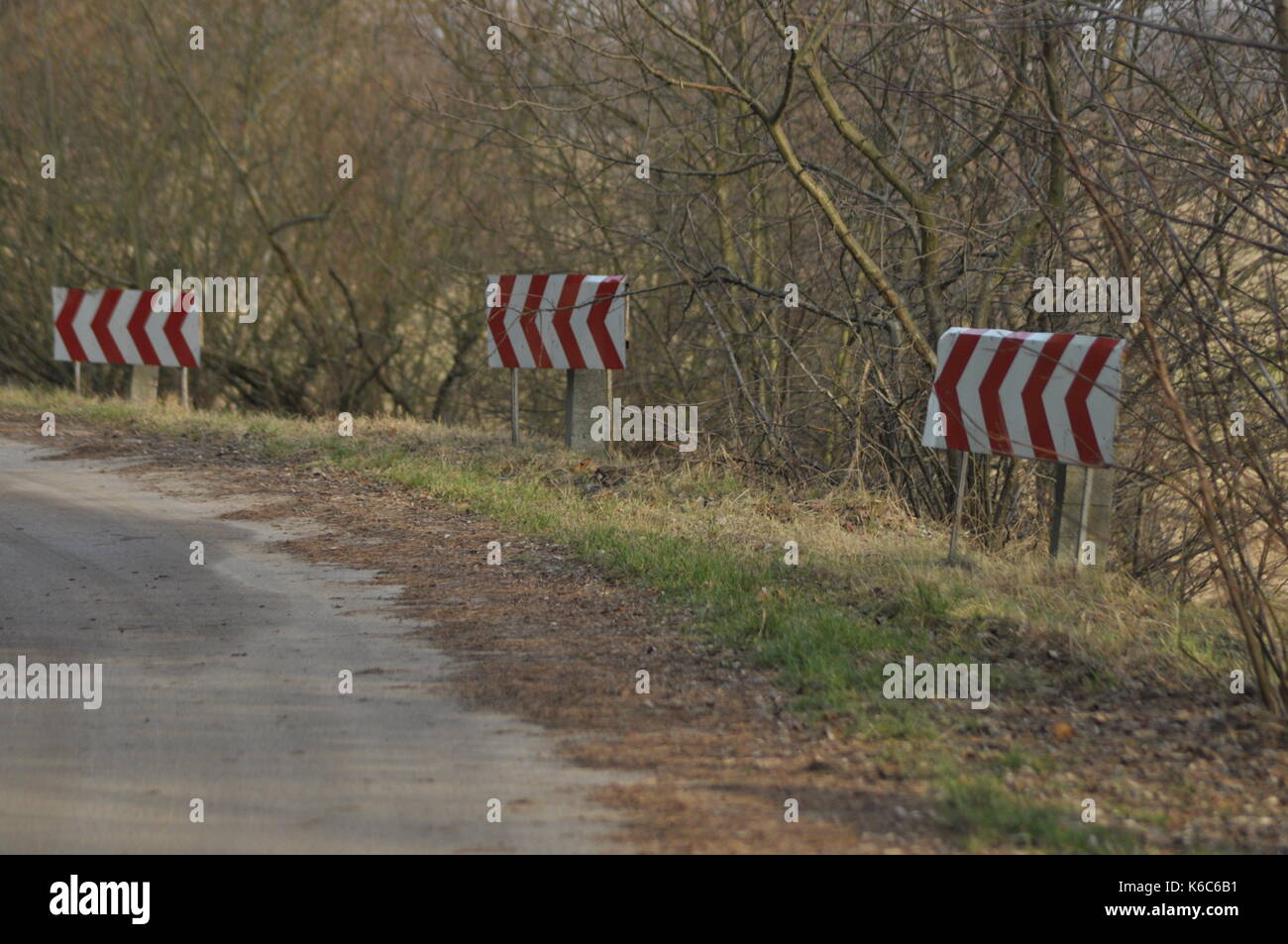 Road signs, the sign of the bend. Winding road Stock Photo - Alamy