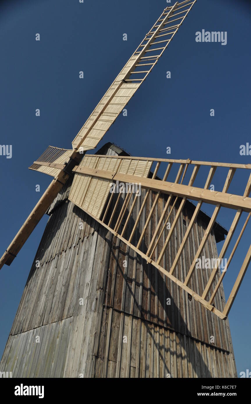 Wooden windmill. Monument. Antique mill powered by the wind Stock Photo ...