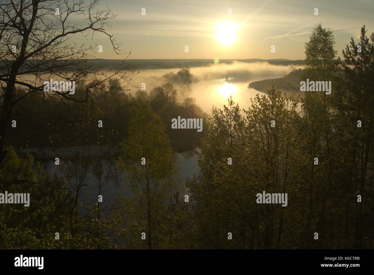 Sunrise. The river in the mist. A view of the meadows and the river in ...