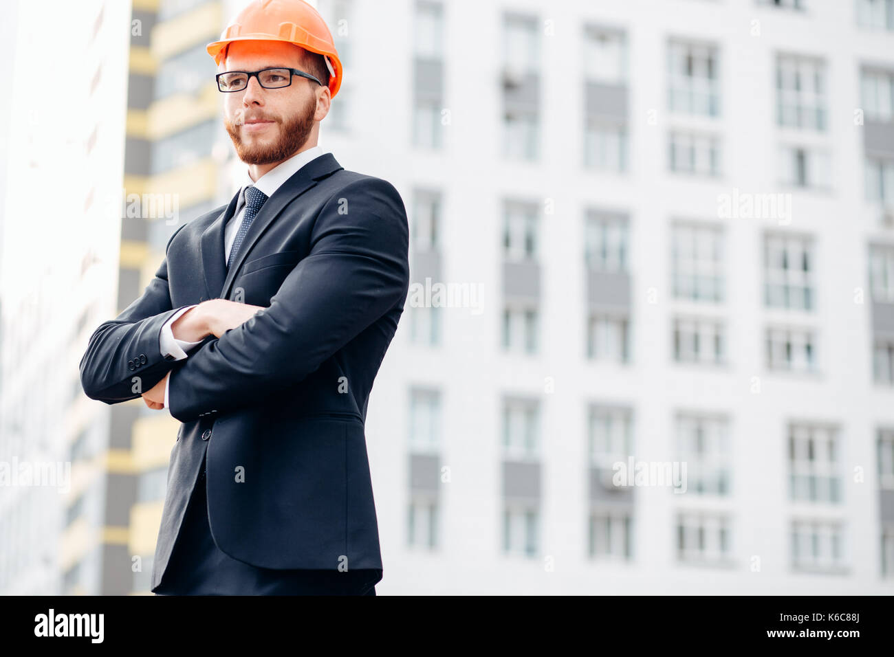 Engineer builder wearing suit and helmet at construction site Stock ...