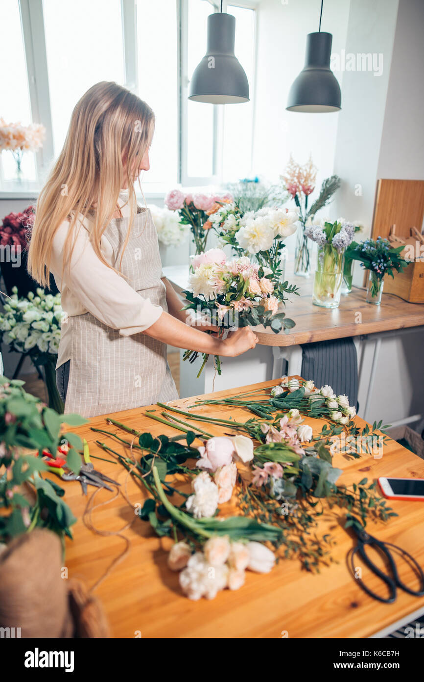 Small business. Male florist unfocused in flower shop. Floral design ...