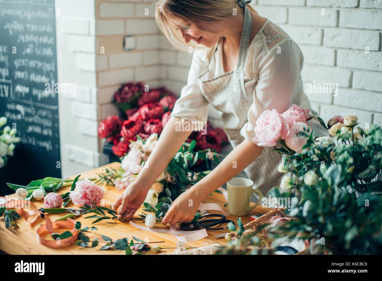 Small business. Male florist unfocused in flower shop. Floral design ...