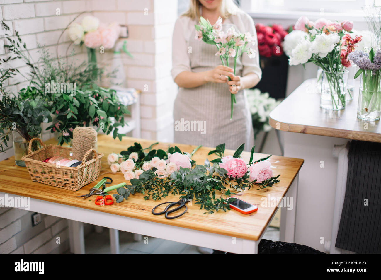 Small business. Male florist unfocused in flower shop. Floral design ...