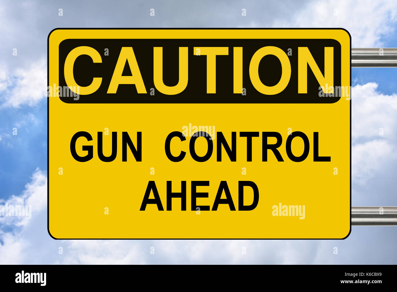 Gun control ahead, yellow road warning sign Stock Photo - Alamy