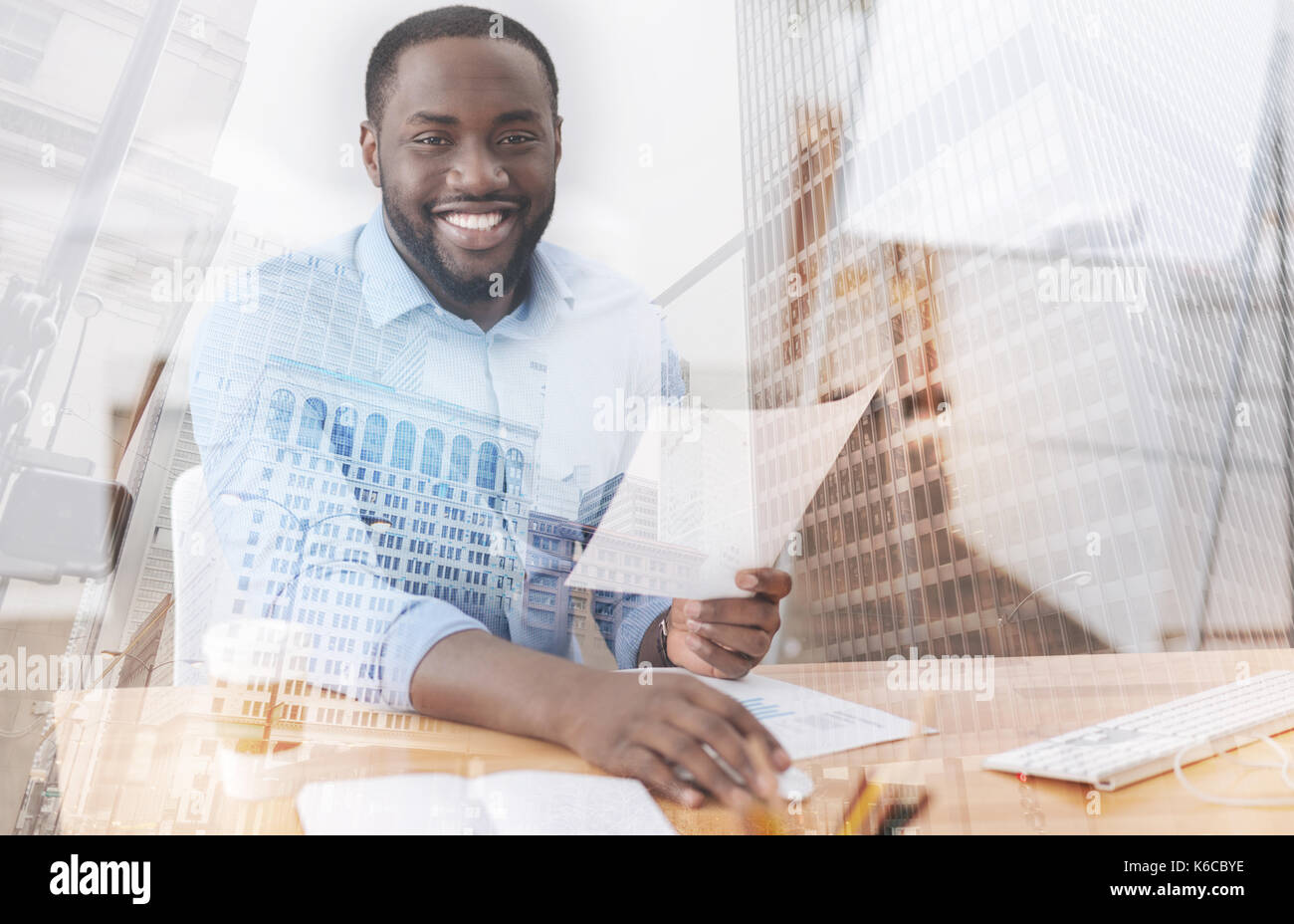 Delighted employee reading a document Stock Photo - Alamy