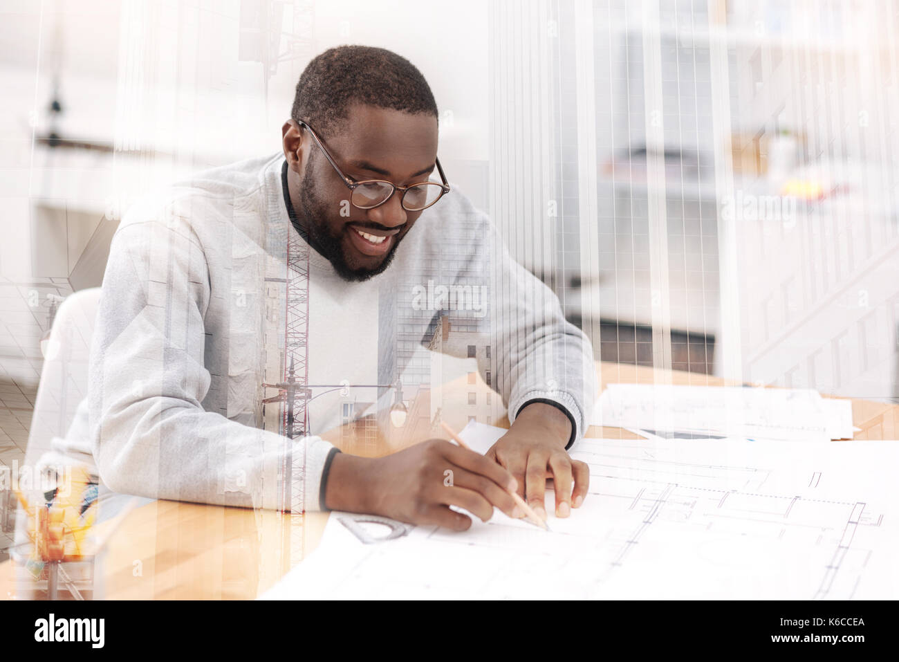Close up of attentive engineer drawing a new work Stock Photo - Alamy