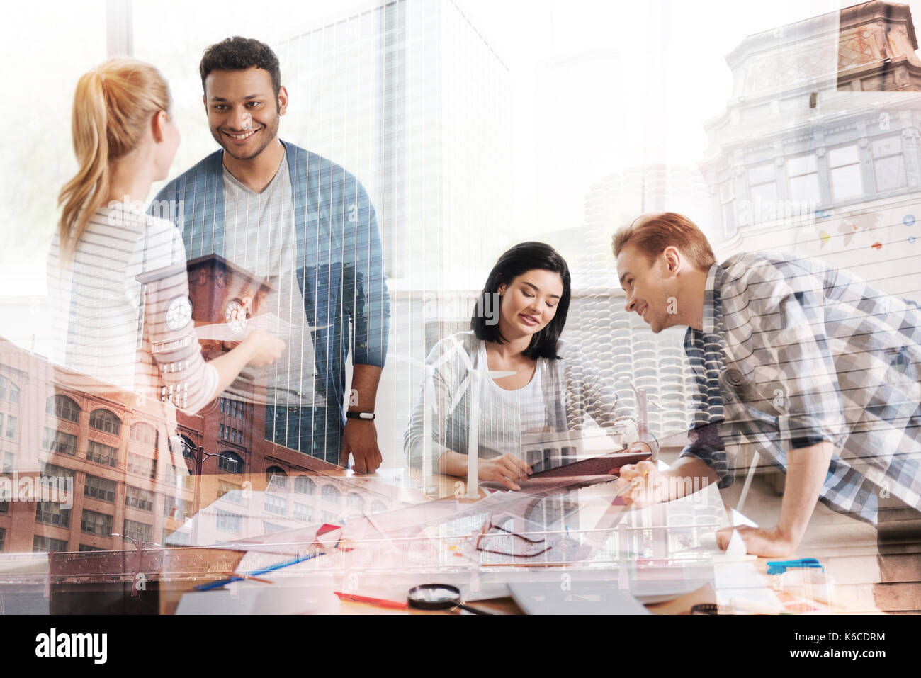 Young engineers working in their office Stock Photo - Alamy