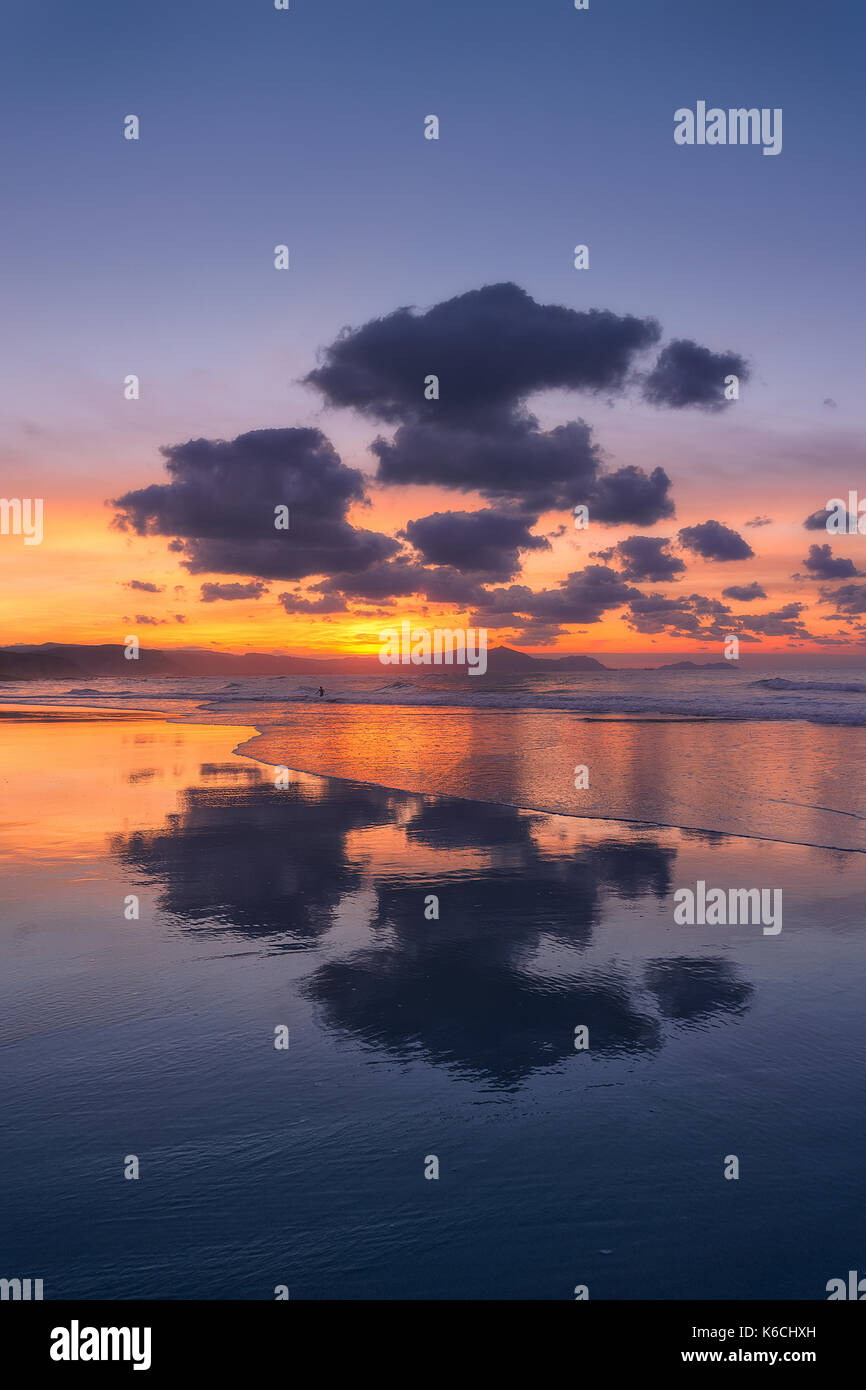 clouds reflections on the beach Stock Photo - Alamy