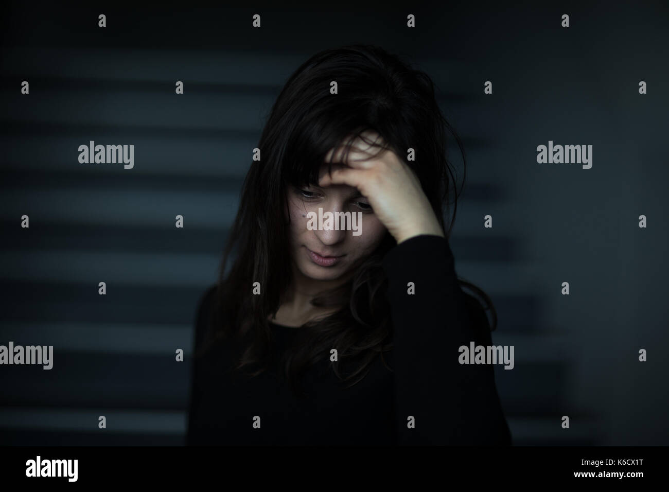 Young woman suffering from severe depression/anxiety (shallow DOF ...
