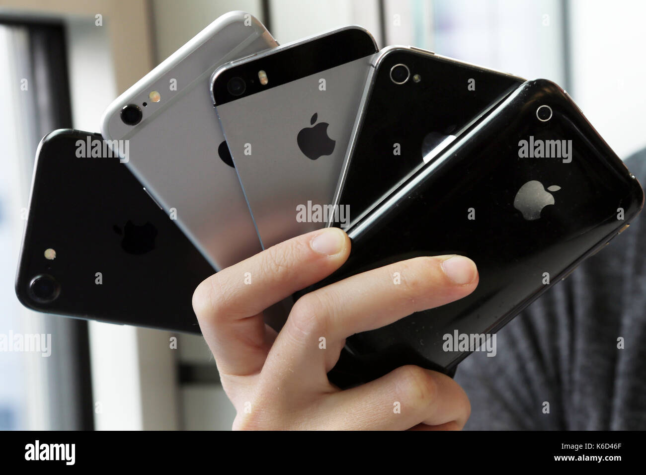 Berlin, Germany. 12th Sep, 2017. ILLUSTRATION - A young woman holds ...