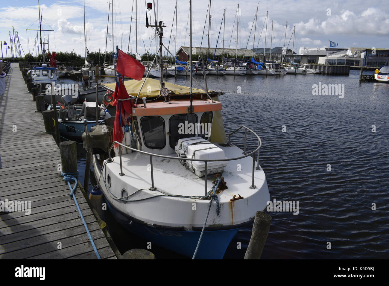 Boats, yachts and fishing boats can be seen in the harbour of ...