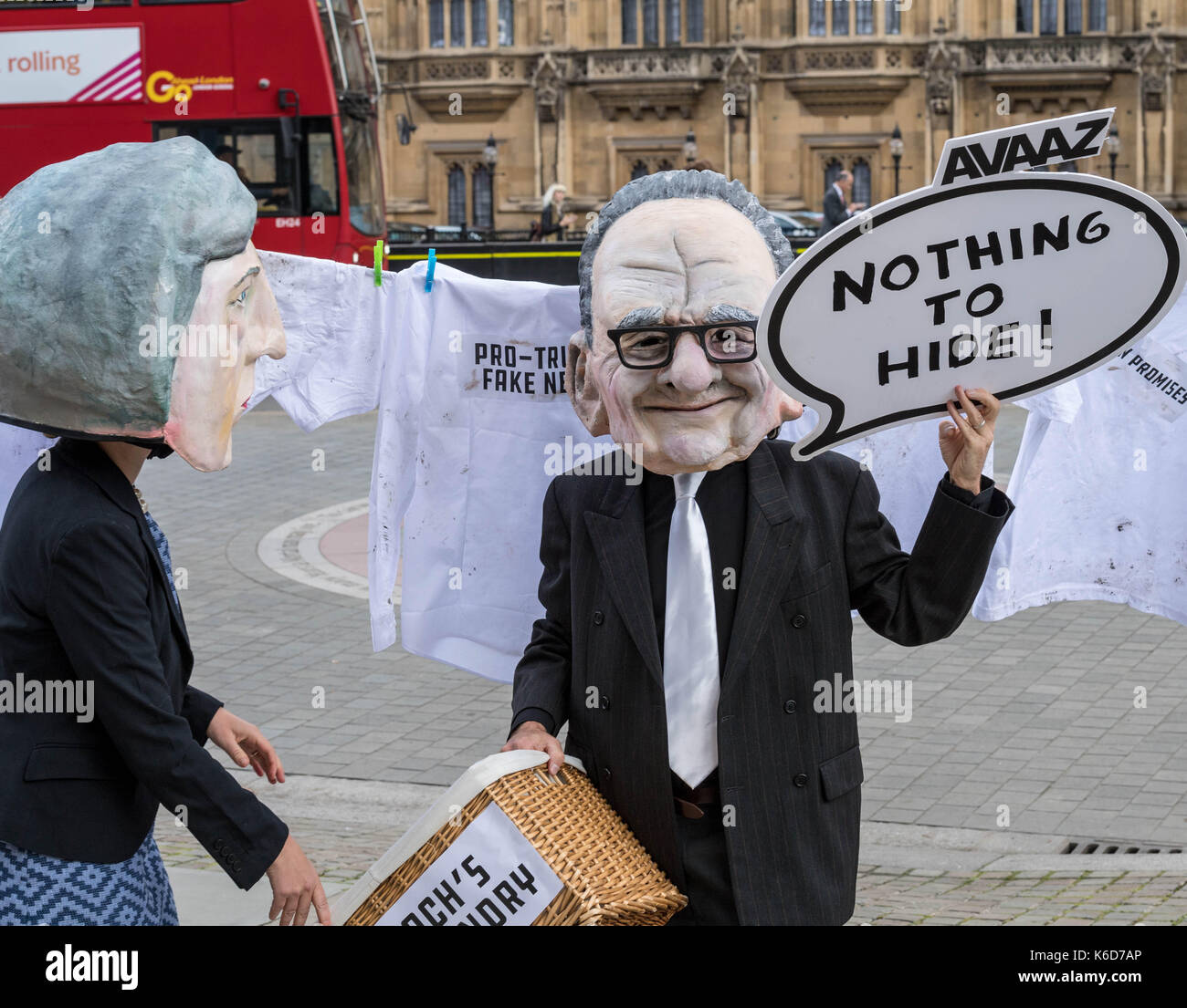 London, UK. 12th Sep, 2017. Masked protesters wait outside Parliament ...