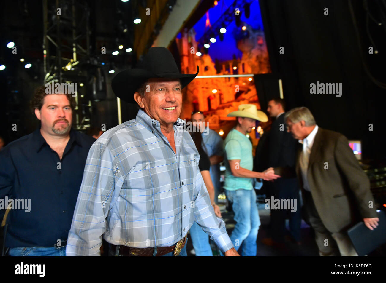 GEORGE STRAIT smiles after leaving a press conference Tuesday regarding ...