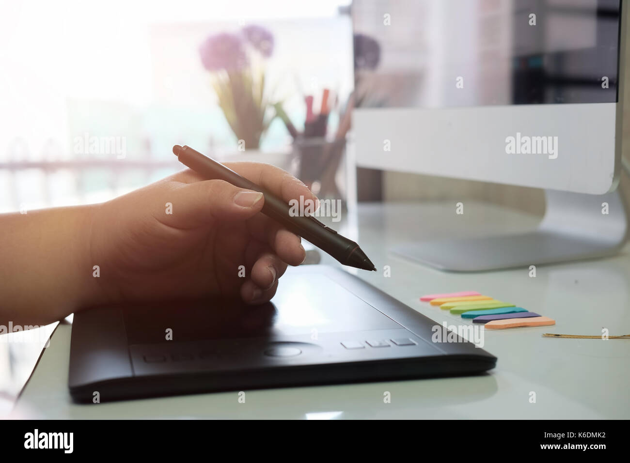 graphic design desk hand using mouse pan sketch device on creative desk ...